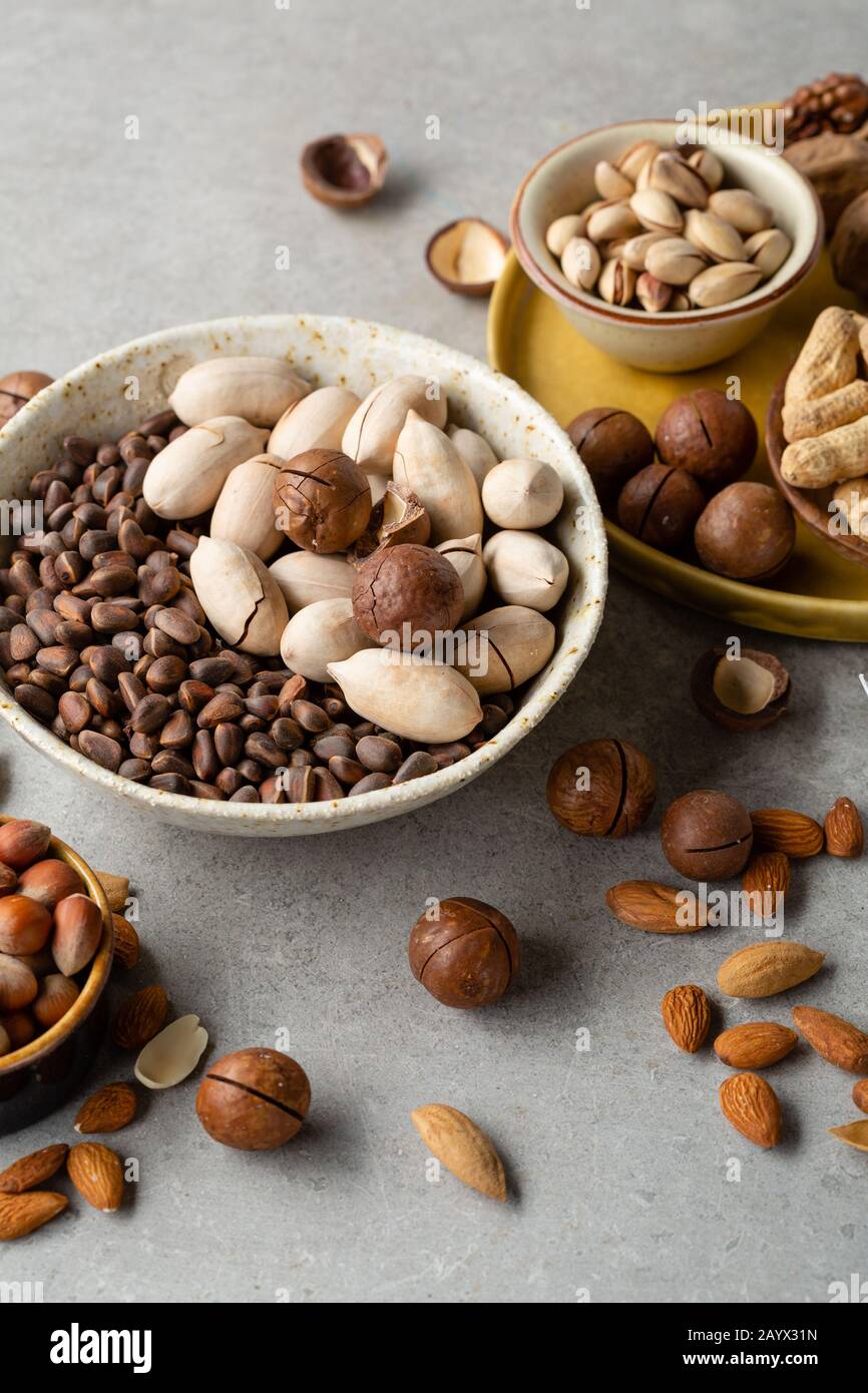 Pine nuts and pecan in bowl, healthy nuts Stock Photo - Alamy