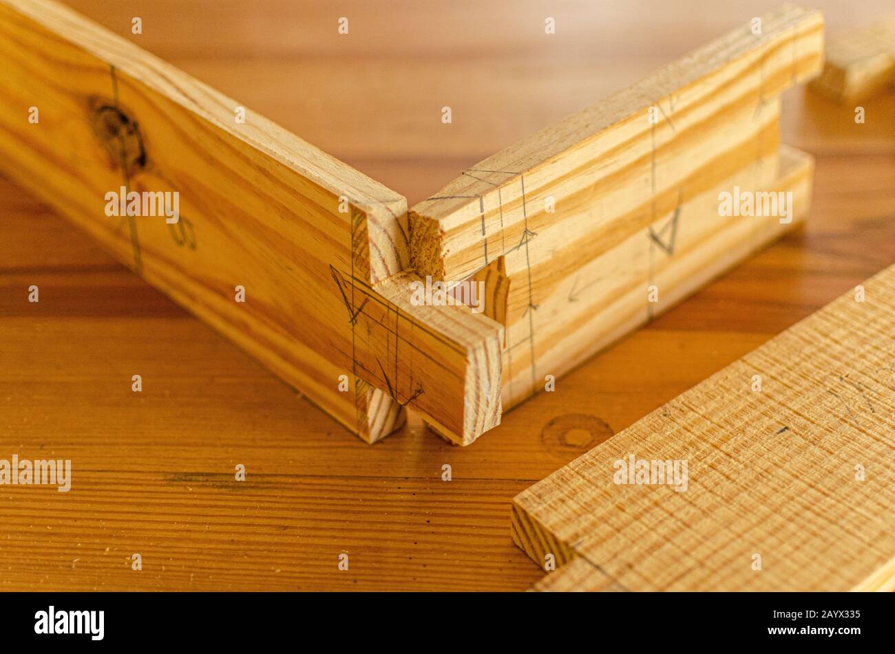 Practical illustration of a box joint using two wooden pieces shown and ...