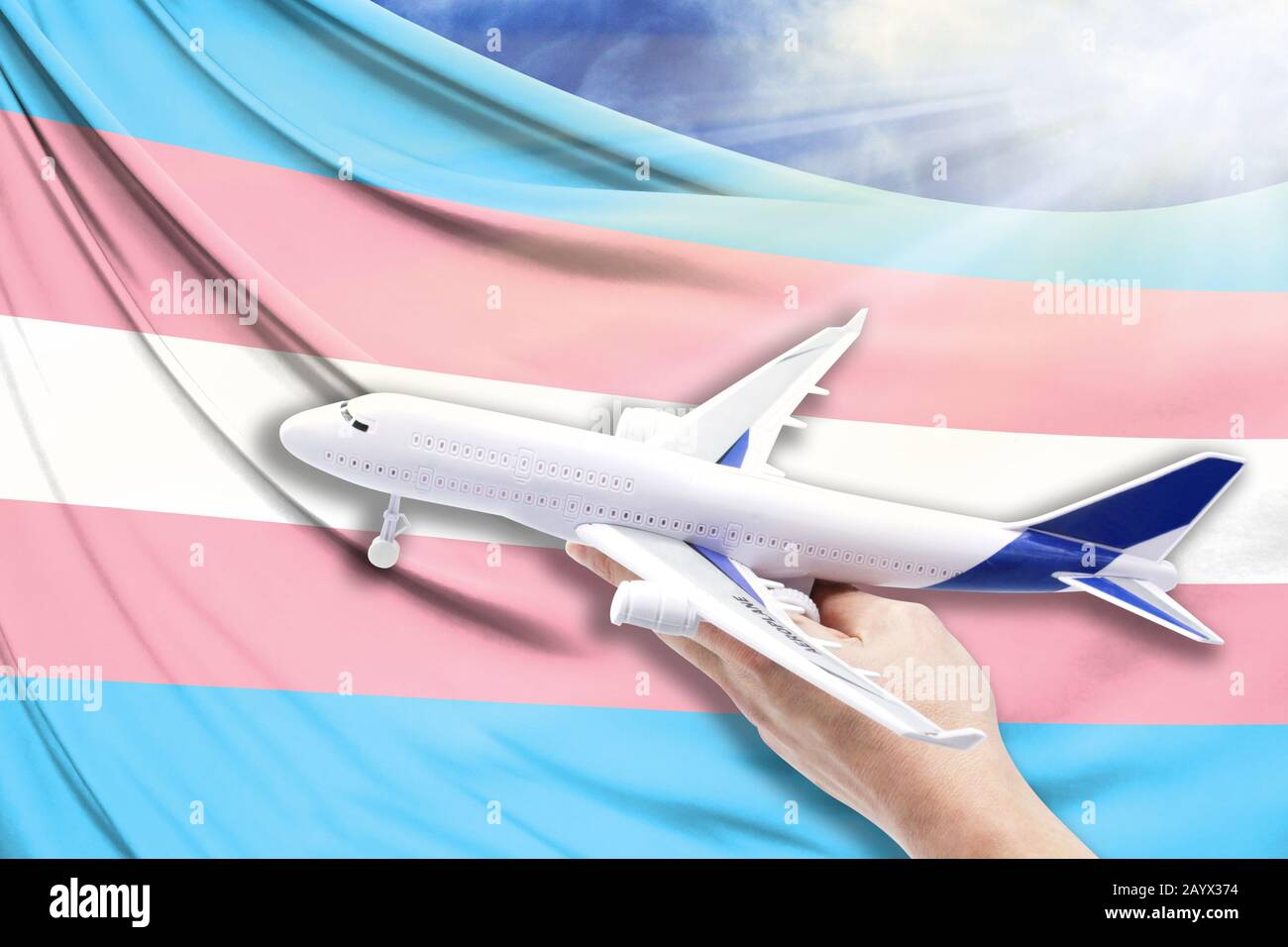 Airplane in hand with national flag of Transgender on a background of ...
