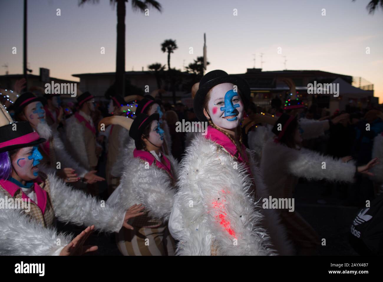 VIAREGGIO,ITALY-FEB.15 2020: masked persons parade in the street of ...