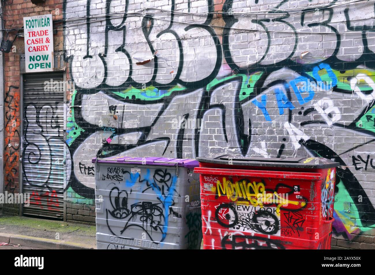 Artwork and graffiti, which some would call vandalism, decorate streets ...