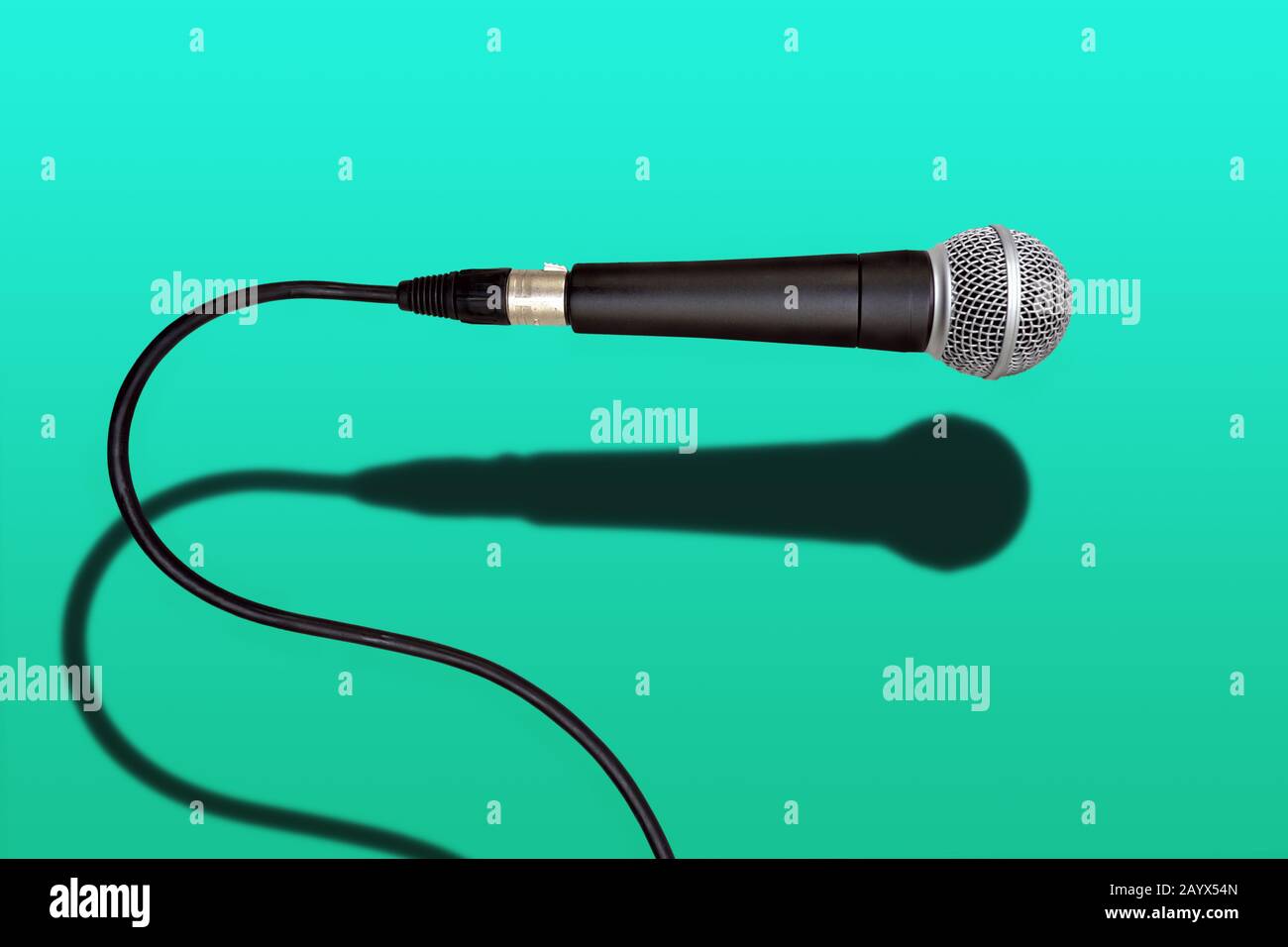wired singer black and grey microphone on green color background Stock ...