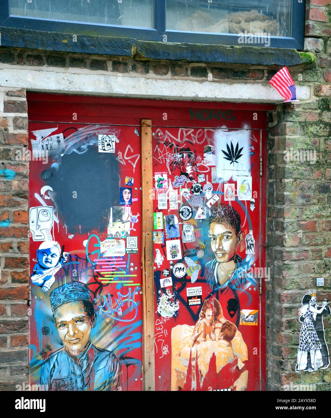 Artwork and graffiti, which some would call vandalism, decorate streets ...