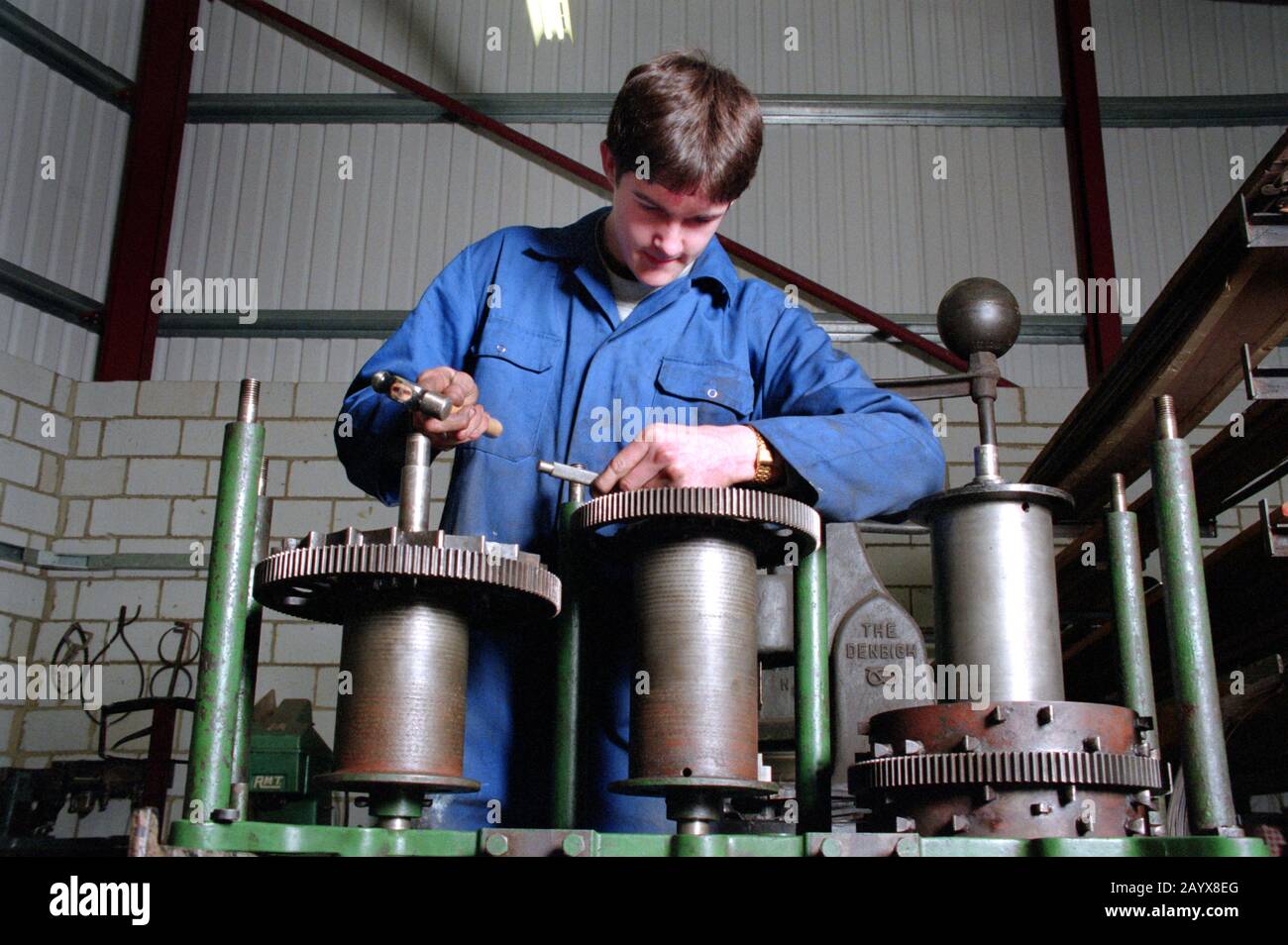 modern apprentice, clock maker Stock Photo - Alamy