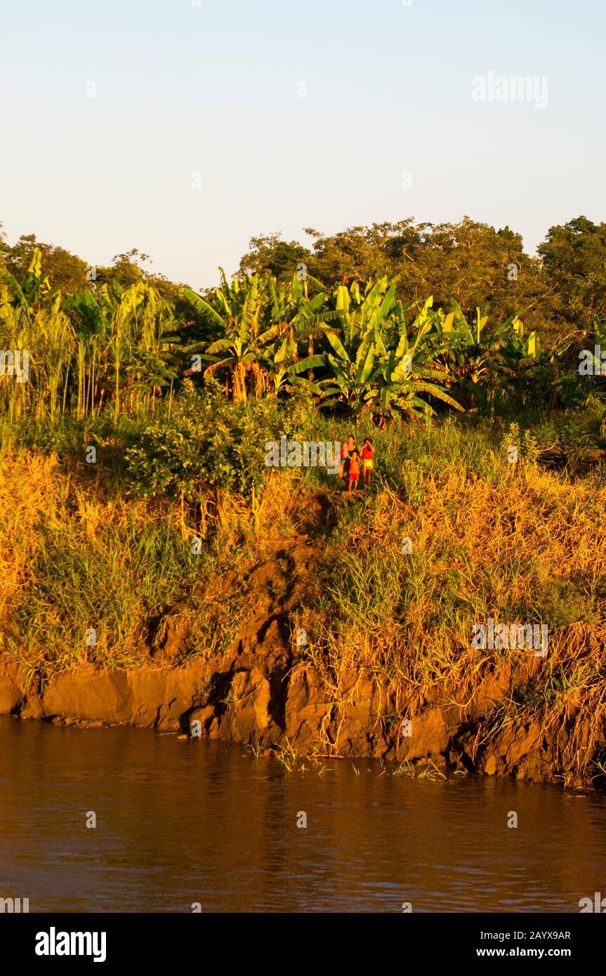 Local children on the river bank of the Amazon River in the Peruvian ...