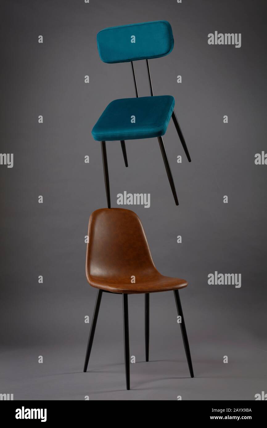 two chairs balanced to show strength and agility Stock Photo - Alamy