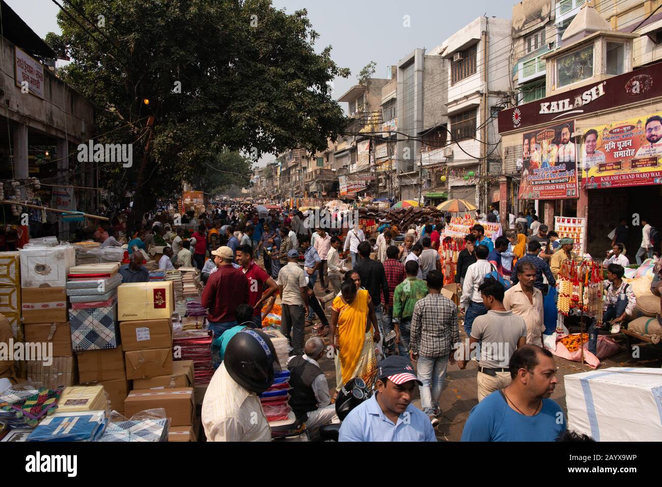 Merchants make their way through the crowded streets of the market in ...