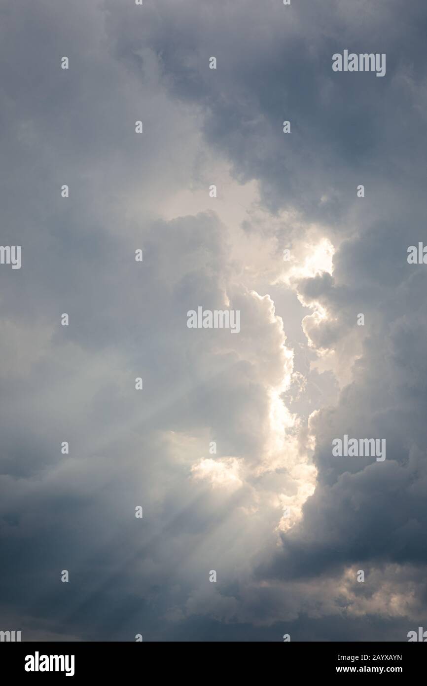Sunbeam between storm clouds cloudscape sky view Stock Photo - Alamy