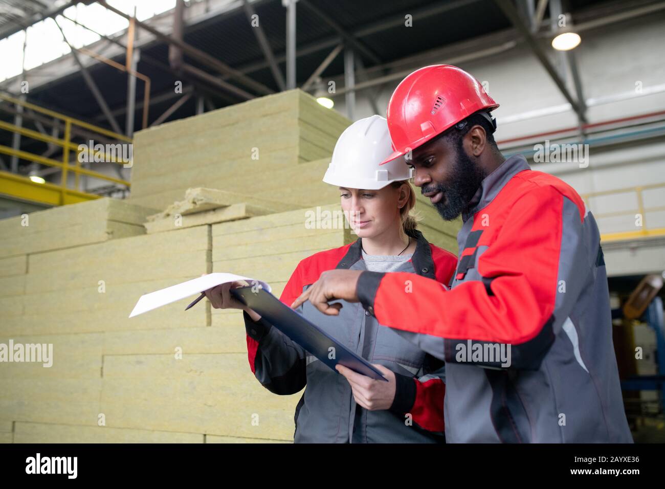 Horizontal medium portrait shot of two professional factory engineers ...