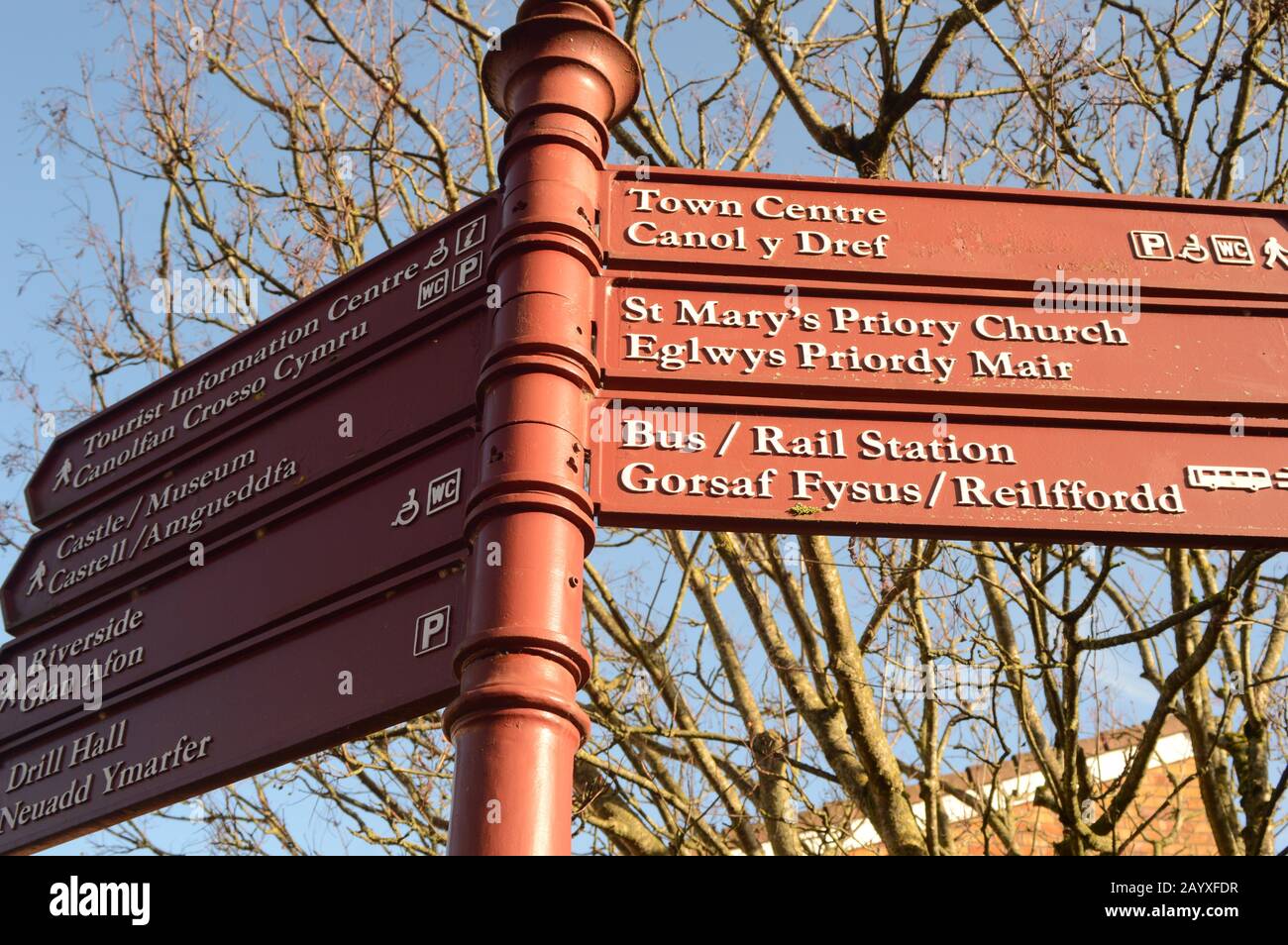 Chepstow: an informing signpost showing direction to the castle, museum ...