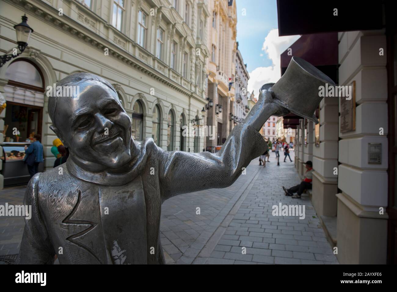 Street scene with bronze statue in Bratislava, the capital of Slovakia ...