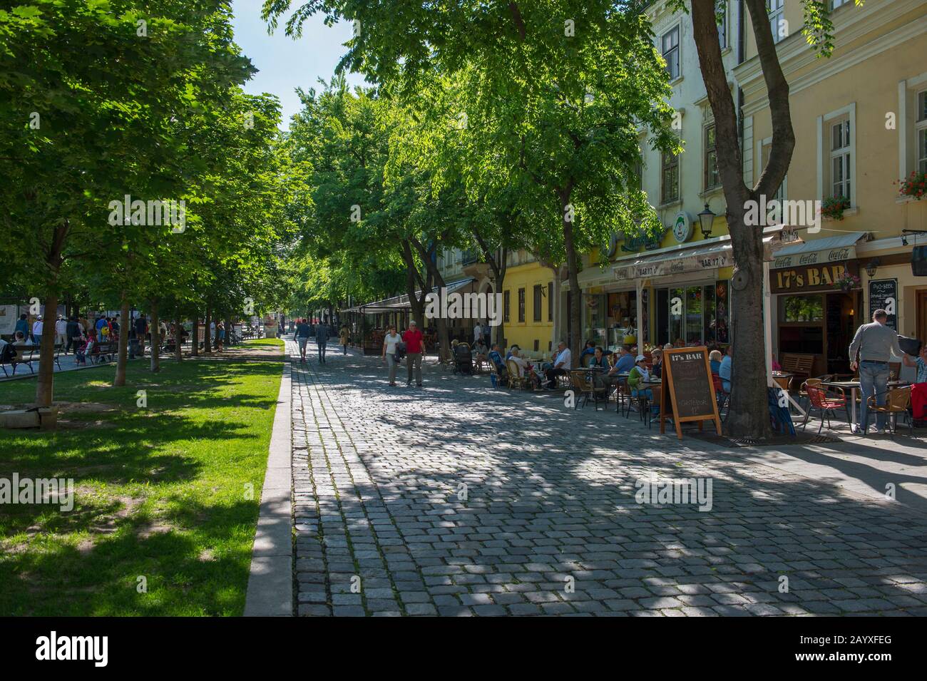 Street scene with people in sidewalk restaurants in Bratislava, the ...