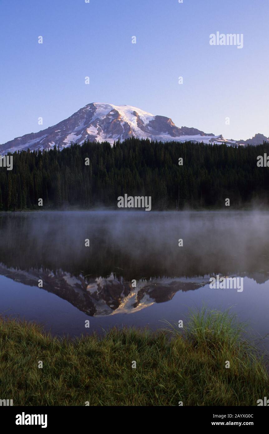 Early morning fog rising from the Reflection Lakes in Mount Rainier ...