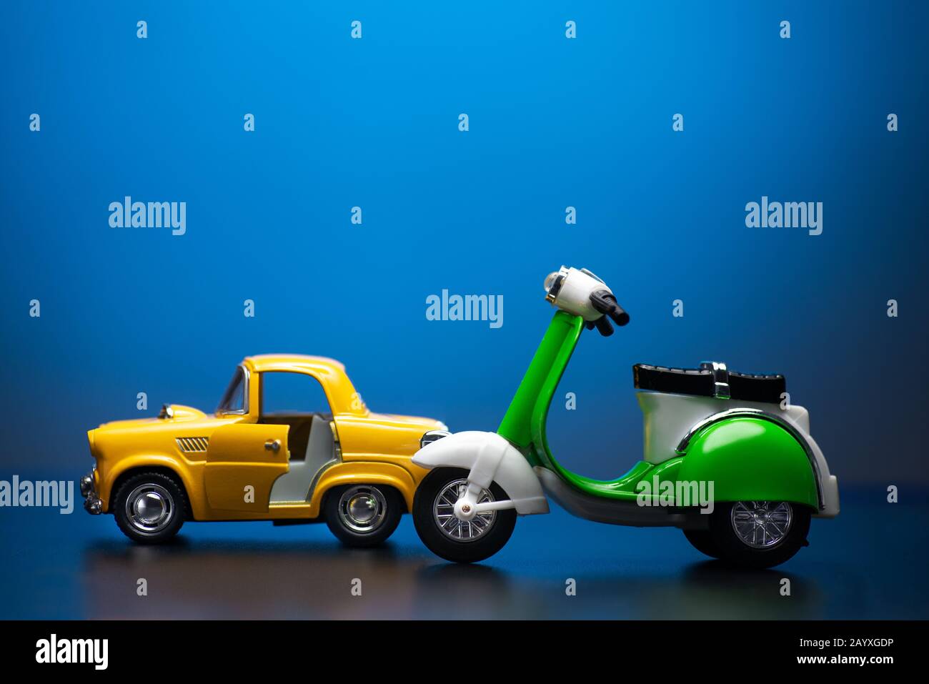 Yellow car and a motorcycle behind it. Yellow car opens the door and it ...