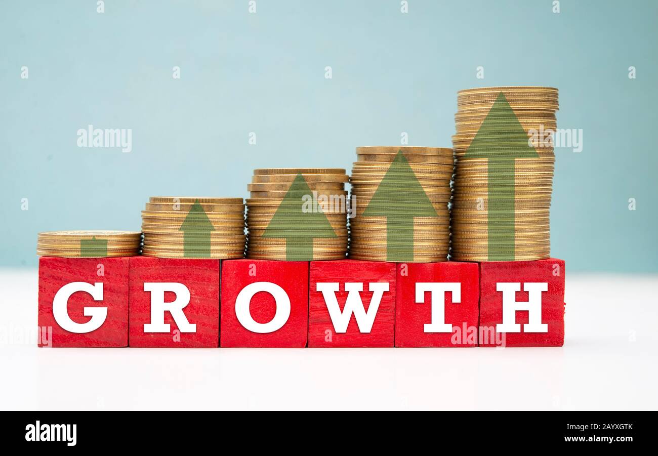 Growth word with gold coins in chart format Stock Photo - Alamy