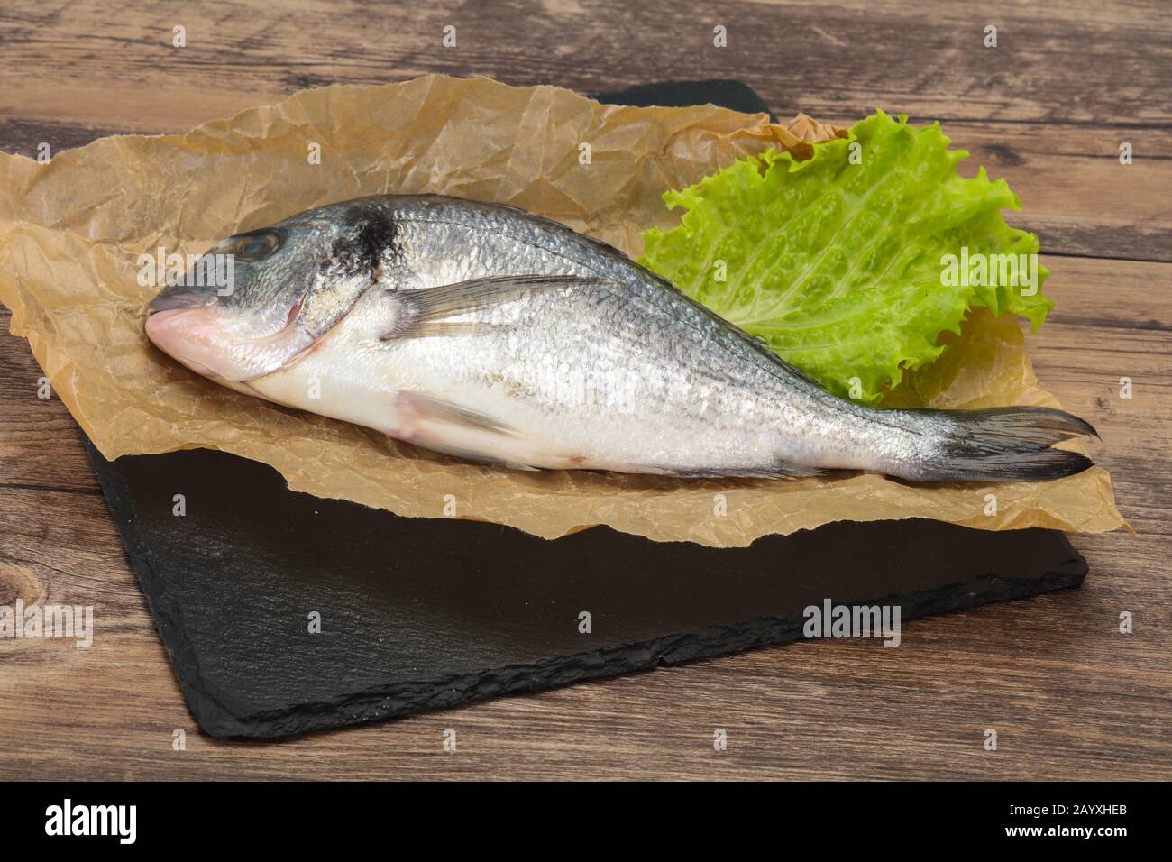 Raw Dorada fish ready for cooking Stock Photo - Alamy