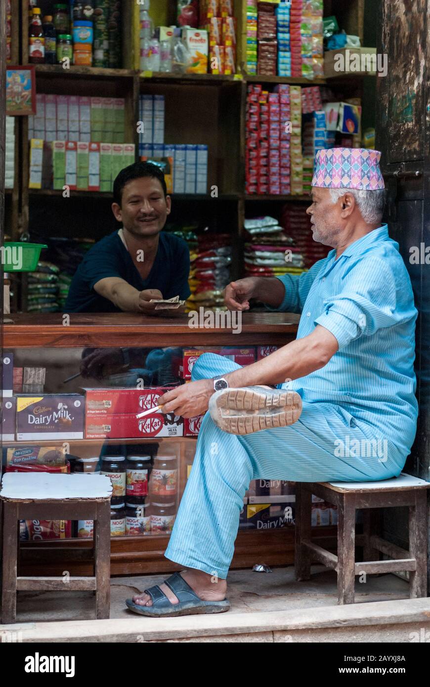 Unidentified Nepalese Newari men in a haberdashery in Bhaktapur, listed ...