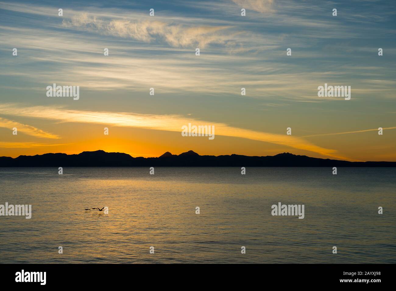 Sunrise over Isla Carmen seen from the town of Loreto, Sea of Cortez ...