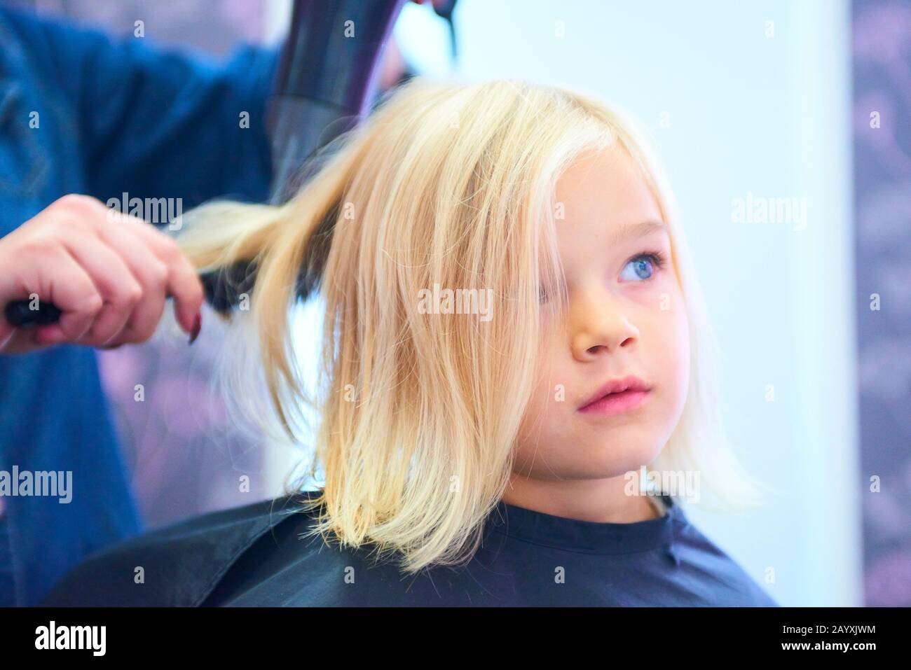 Cute little girl in hairdressing salon. Selective focus Stock Photo - Alamy