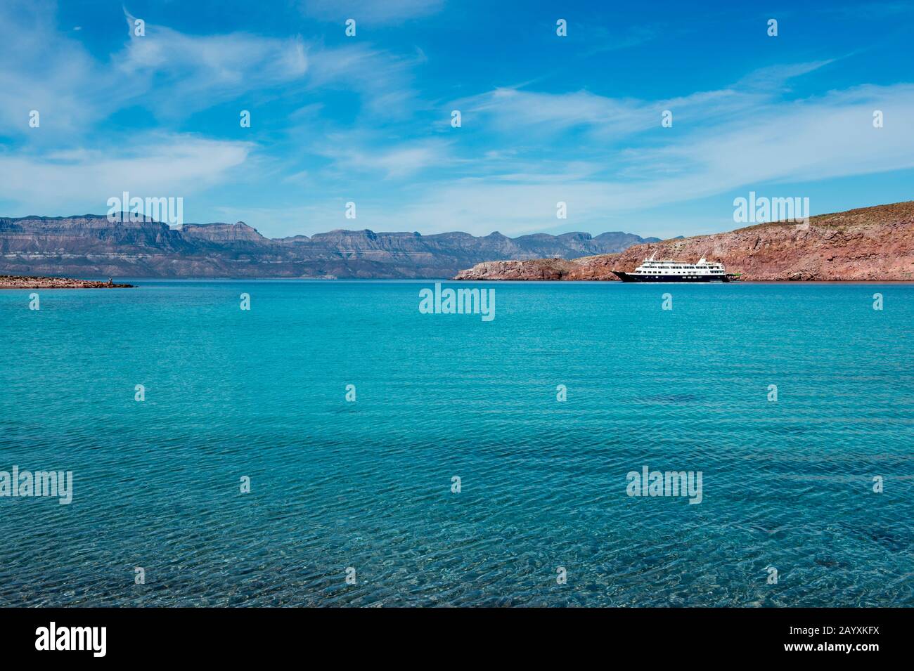Cruise ship Safari Endeavour at anchor in the sheltered bay of San ...
