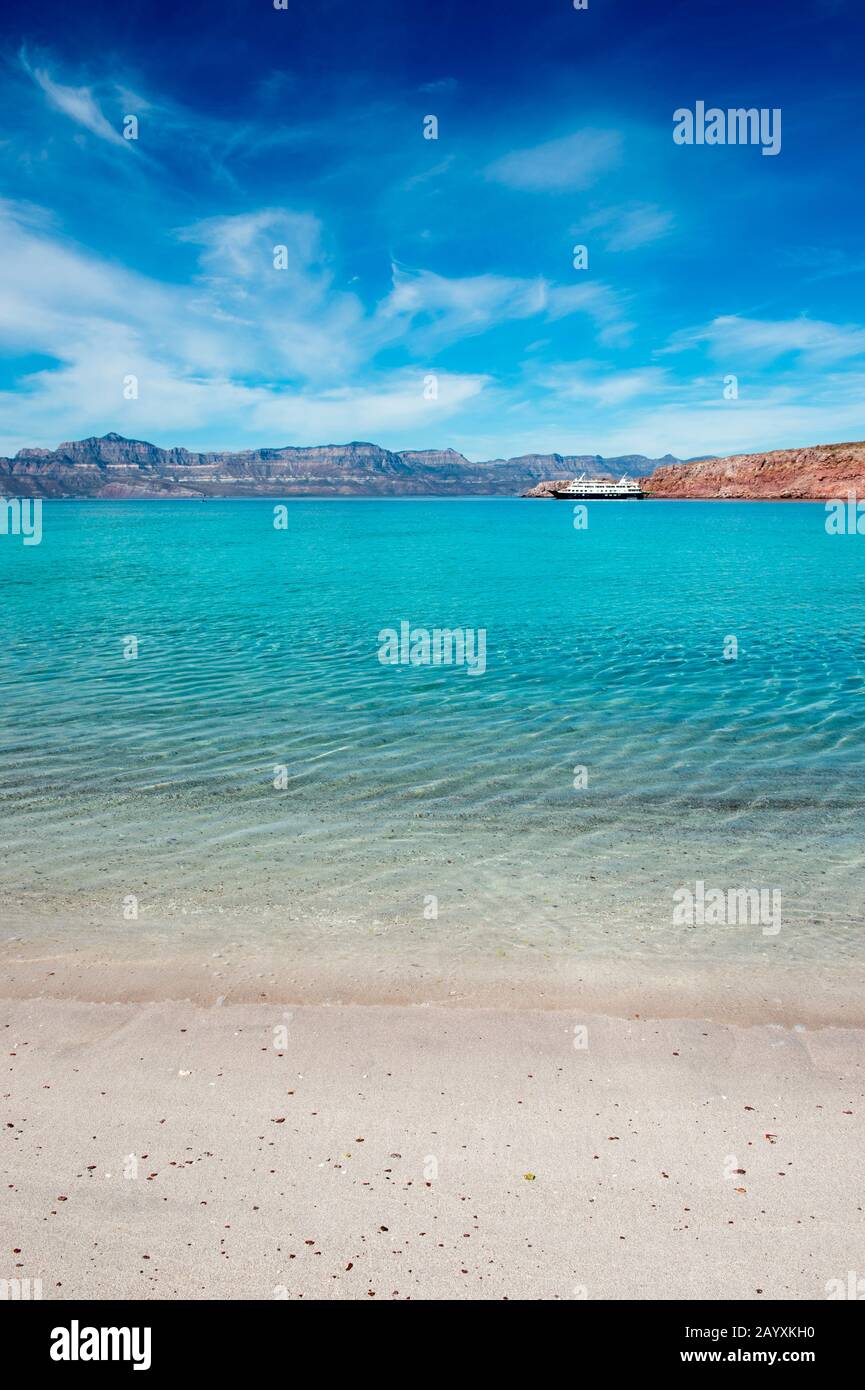 Cruise ship Safari Endeavour at anchor in the sheltered bay of San ...