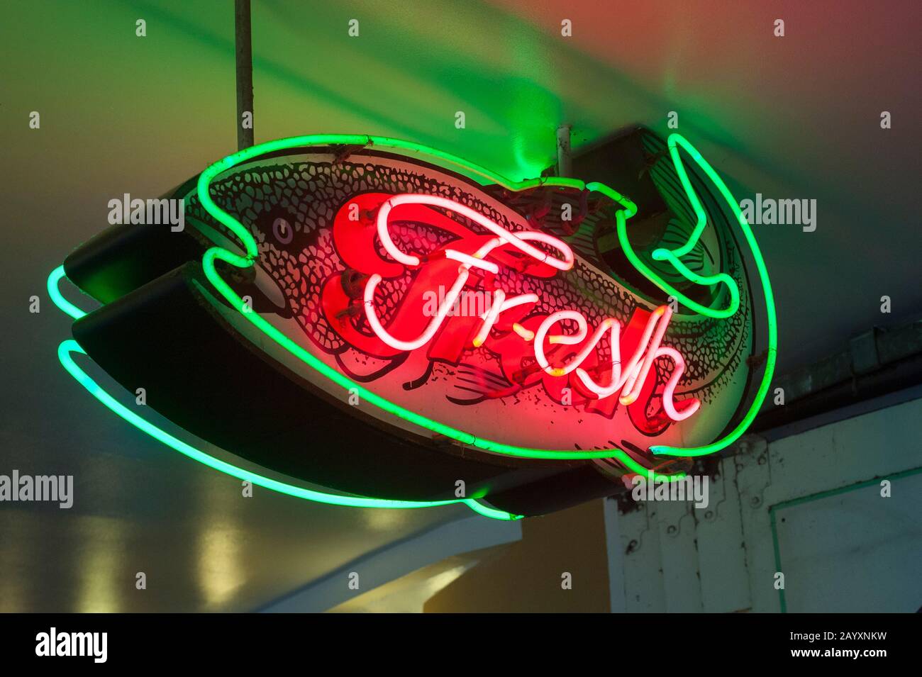 A fresh fish neon sign on the ceiling at the Pike Place Market in ...