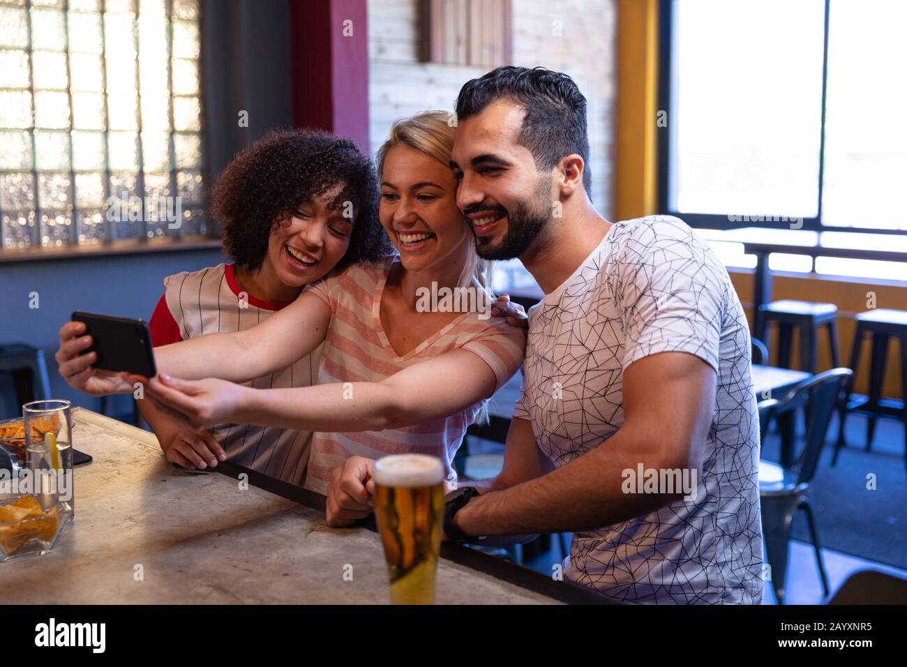 Friends taking selfies together Stock Photo - Alamy