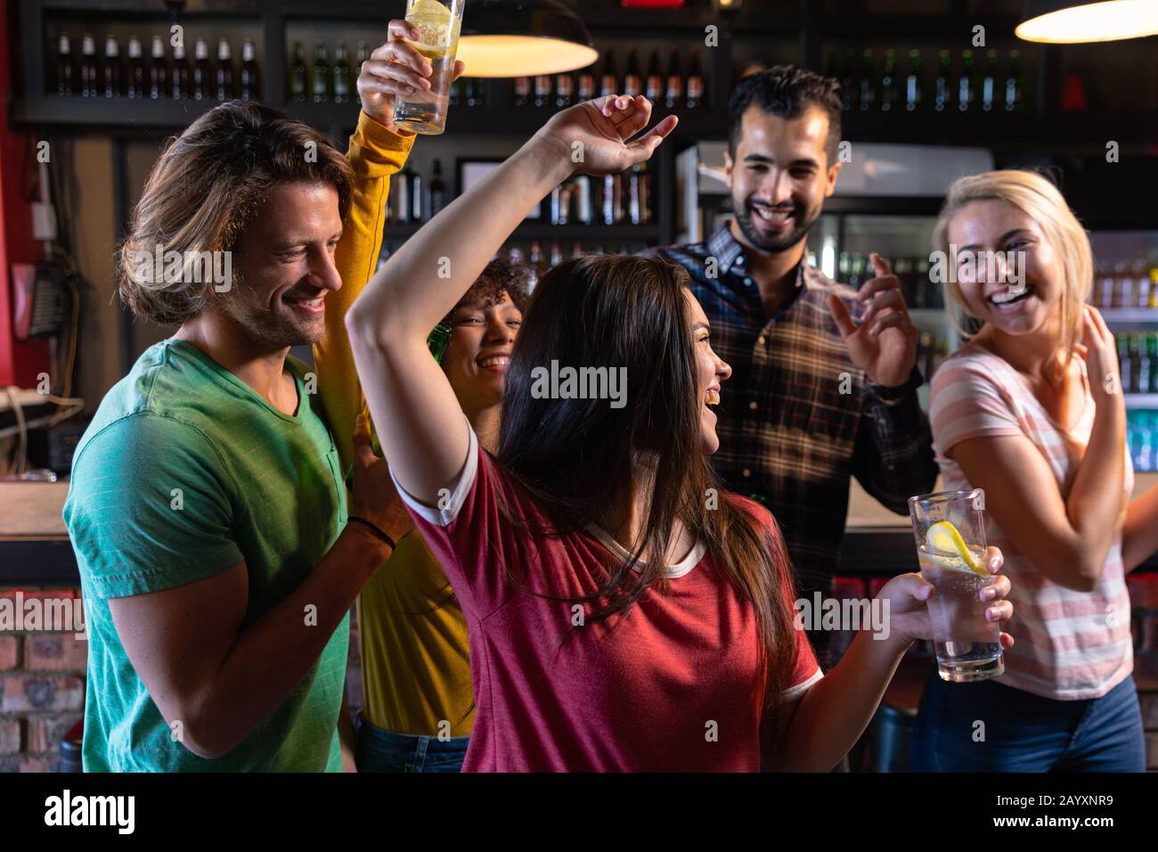 Male friends drinking in pub hi-res stock photography and images - Alamy