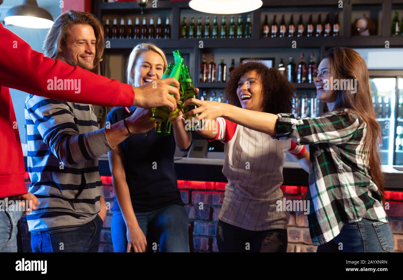 Friends having fun together while drinking Stock Photo - Alamy