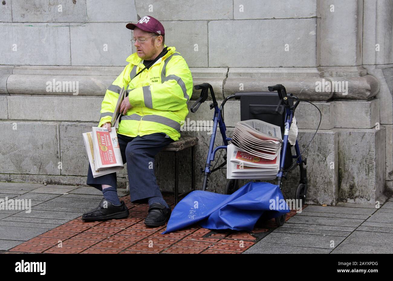 Traditional newspaper crier outside the Post Office on Oliver Plunkett ...