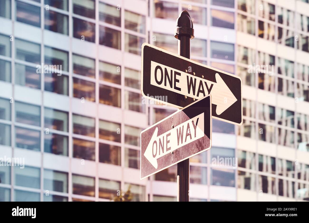 Retro toned picture of one way street signs in New York City, selective ...
