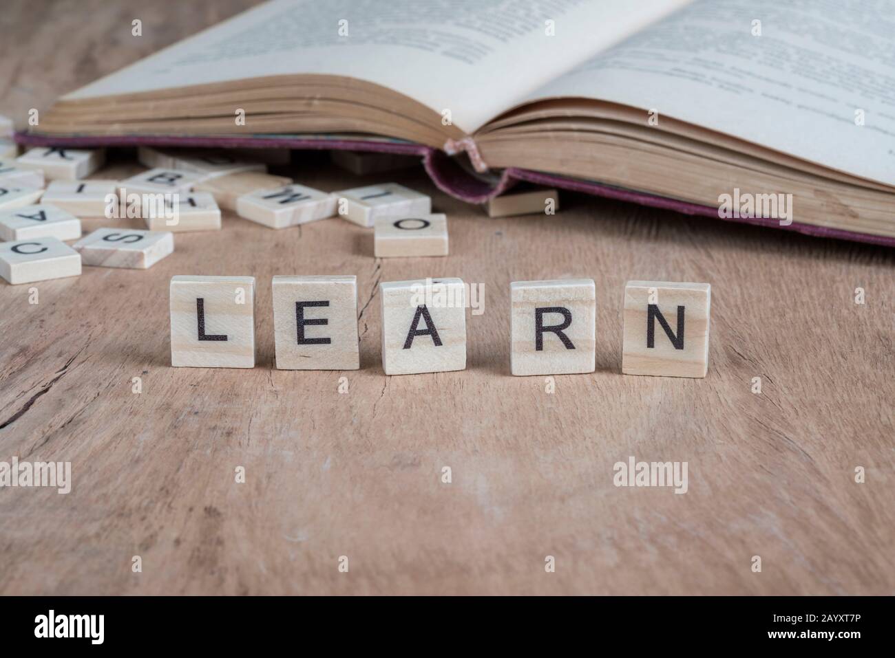 the word learn written with cube letters on wooden background Stock ...