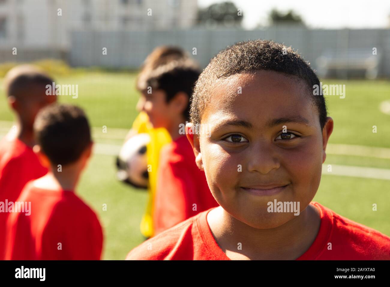 Front view soccer player looking at the camera Stock Photo - Alamy