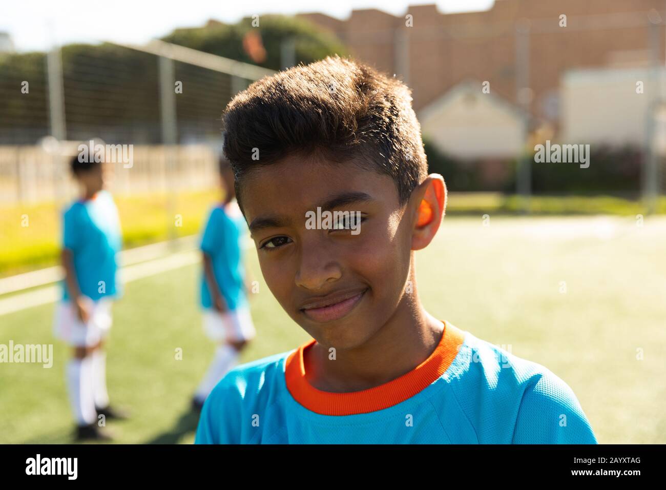 Front view soccer player looking at the camera Stock Photo - Alamy