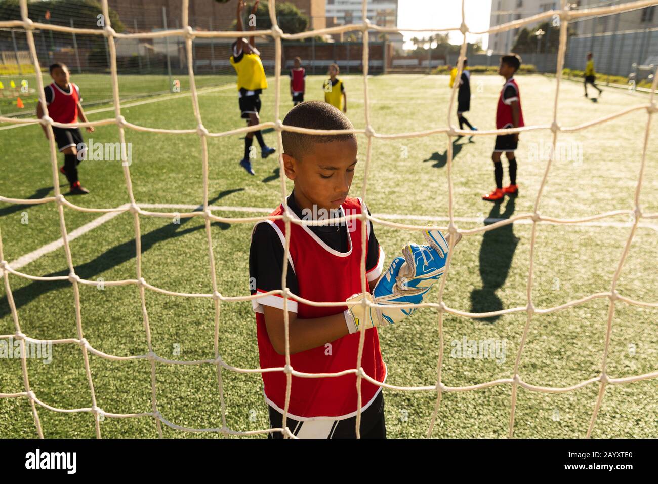Soccer match seen from behind the goal Stock Photo - Alamy