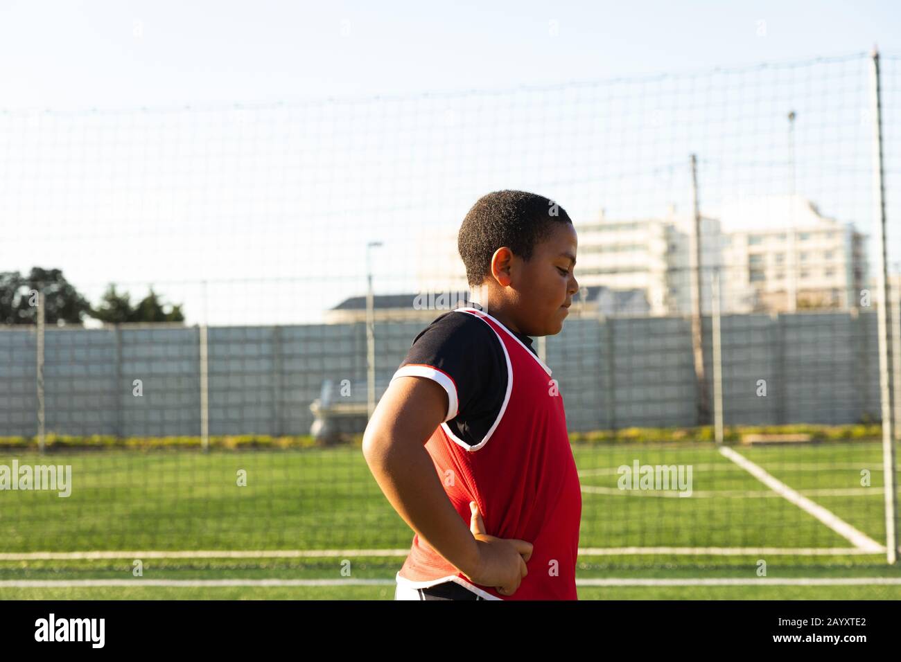 Side view of soccer player breathing Stock Photo - Alamy