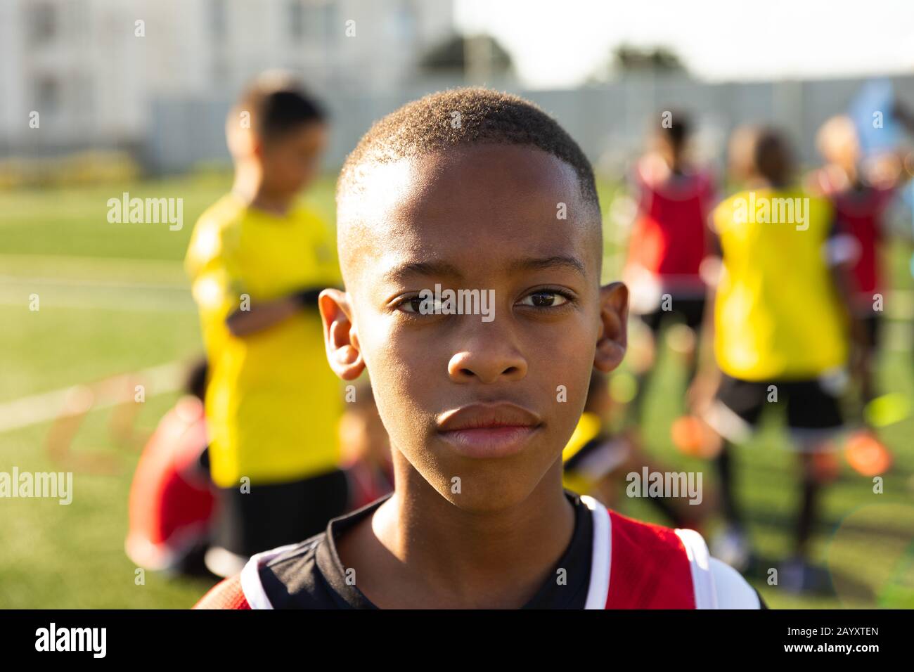 Front view soccer player looking at the camera Stock Photo - Alamy
