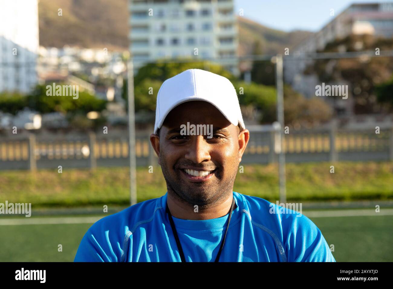 Soccer coach smiling at the camera Stock Photo - Alamy