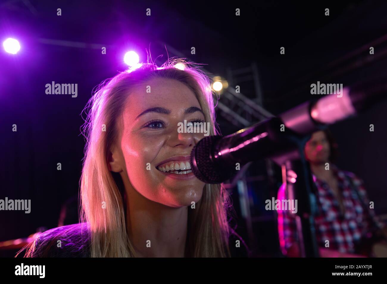 Singer practicing in front of the microphone Stock Photo - Alamy