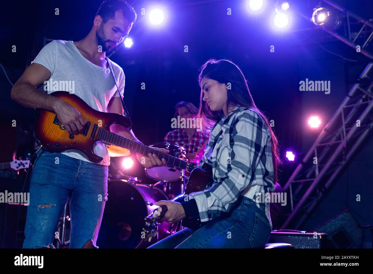 Guitarists performing during the concert Stock Photo - Alamy