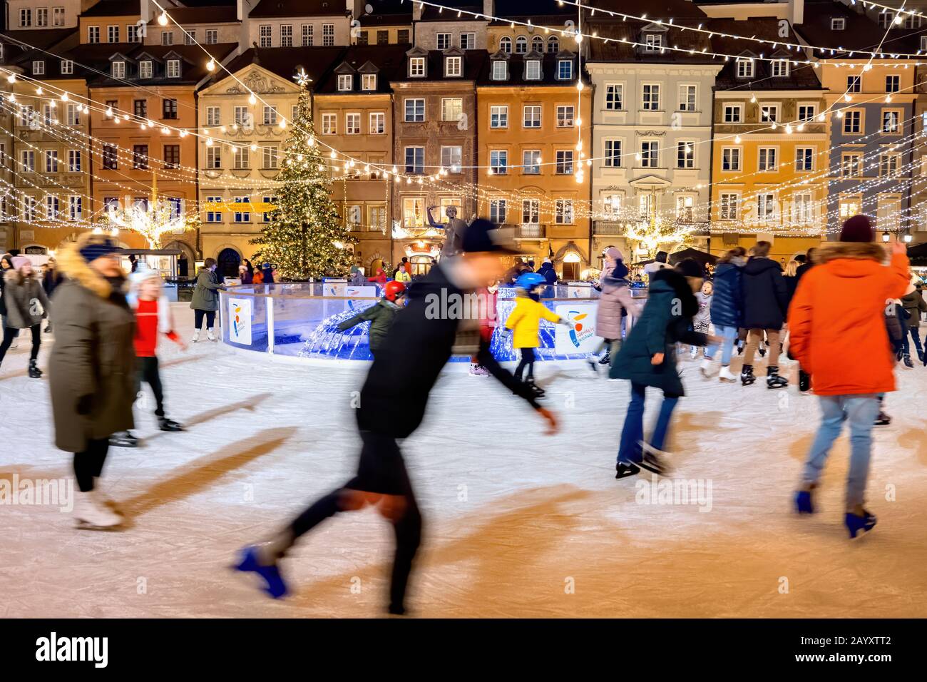 Warsaw, Poland - December 27, 2019: People having fun on ice skating ...