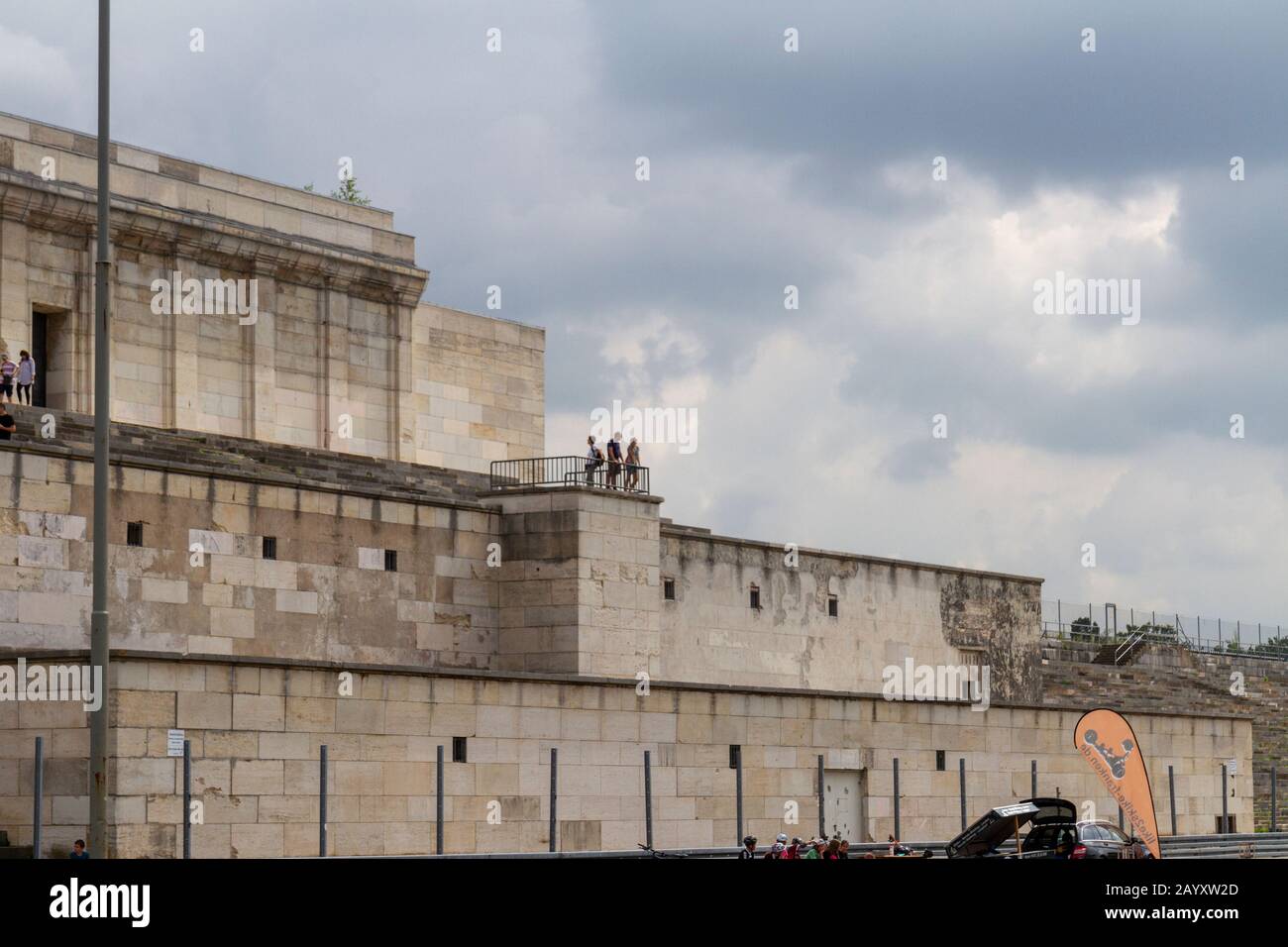 Group of people standing on Adolf Hitlers podium in the main grandstand ...