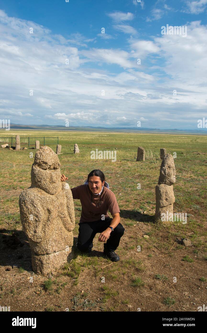 Mongolian man next to Ongot grave (Neolithic grave) in Tuul River ...