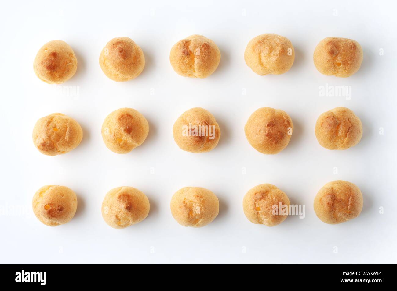 cream puffs aligned closeup isolated on white background Stock Photo ...
