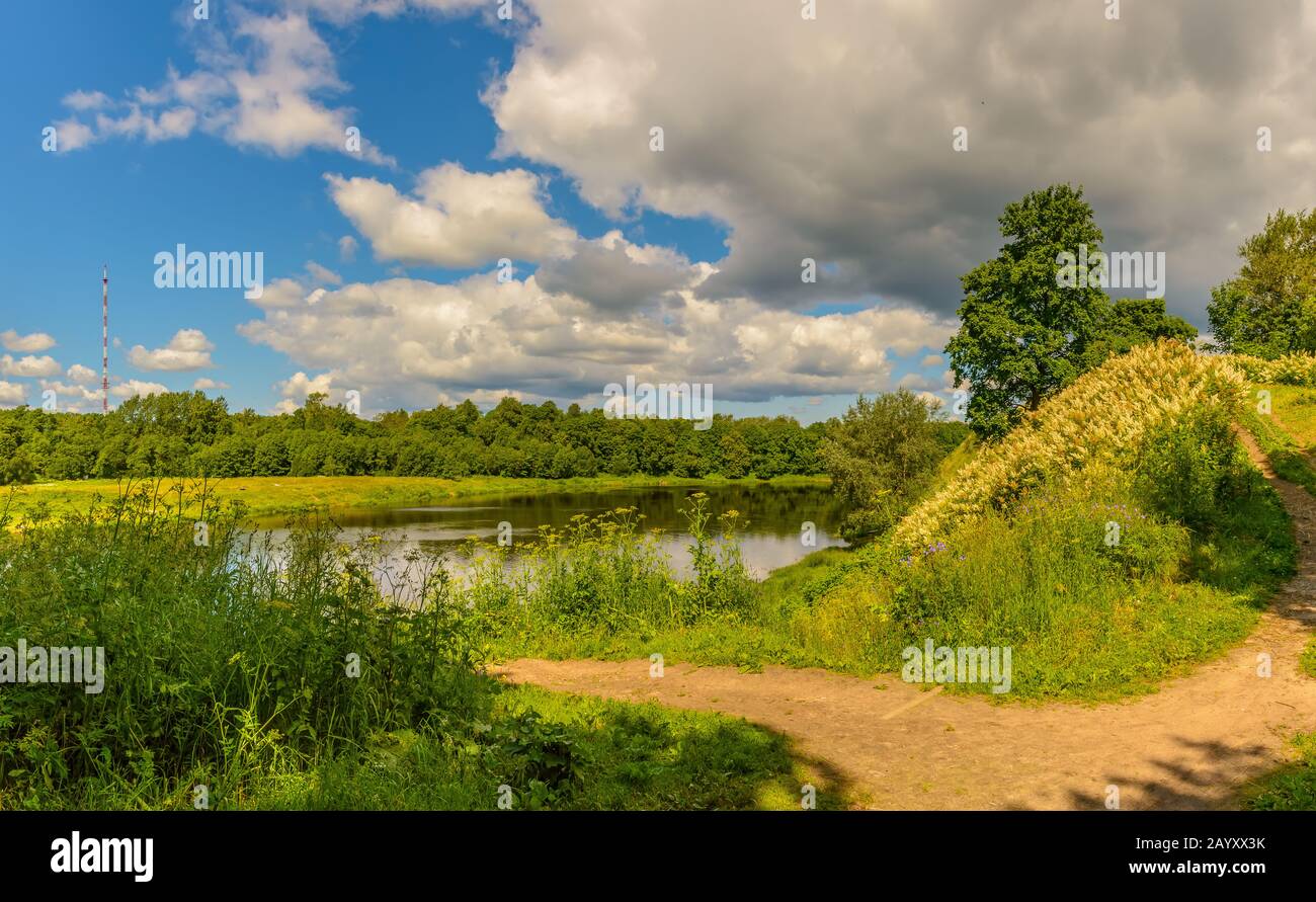 A sunny July day in a park on the banks of the Luga River in Kingisepp ...