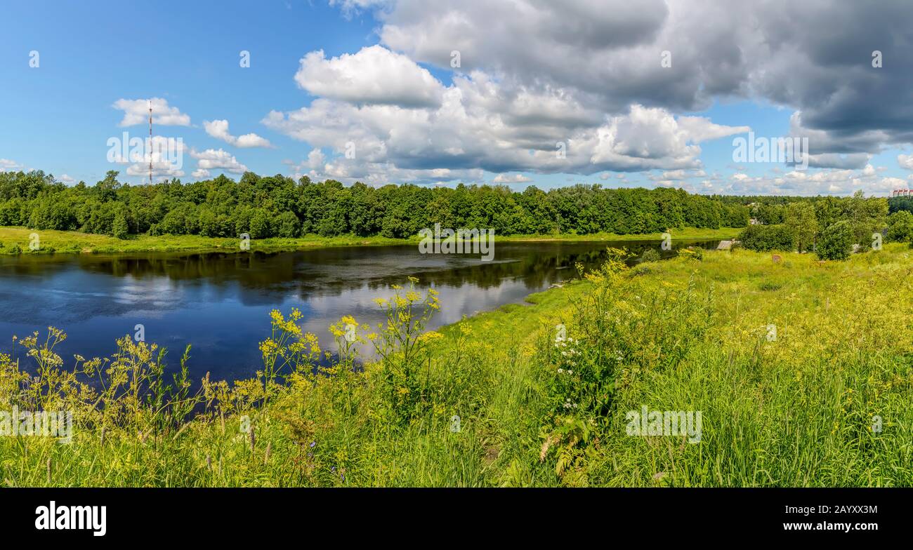 A sunny July day in a park on the banks of the Luga River in Kingisepp ...