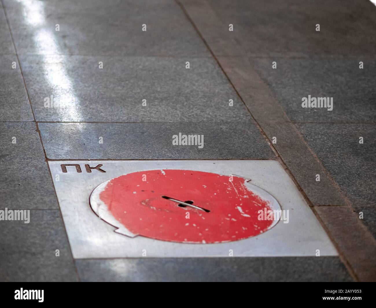 Fire hatches at the Moscow metro station. Red covers on the floor of ...