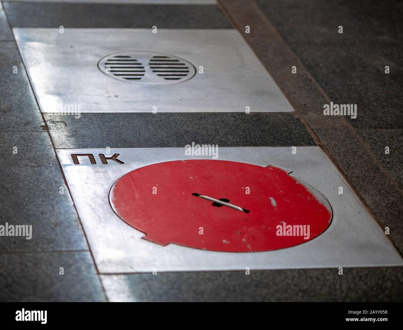 Fire hatches at the Moscow metro station. Red covers on the floor of ...