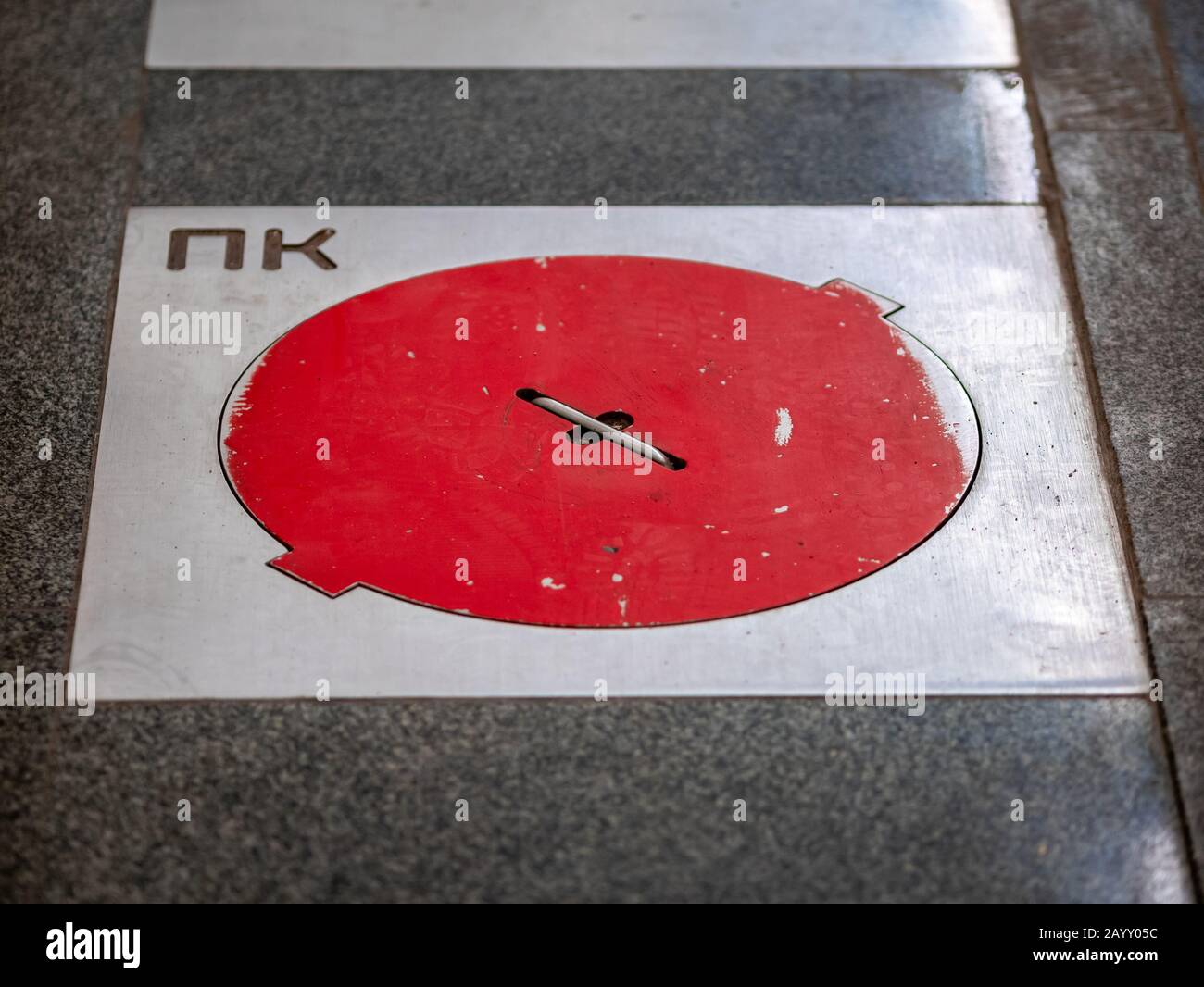 Fire hatches at the Moscow metro station. Red covers on the floor of ...