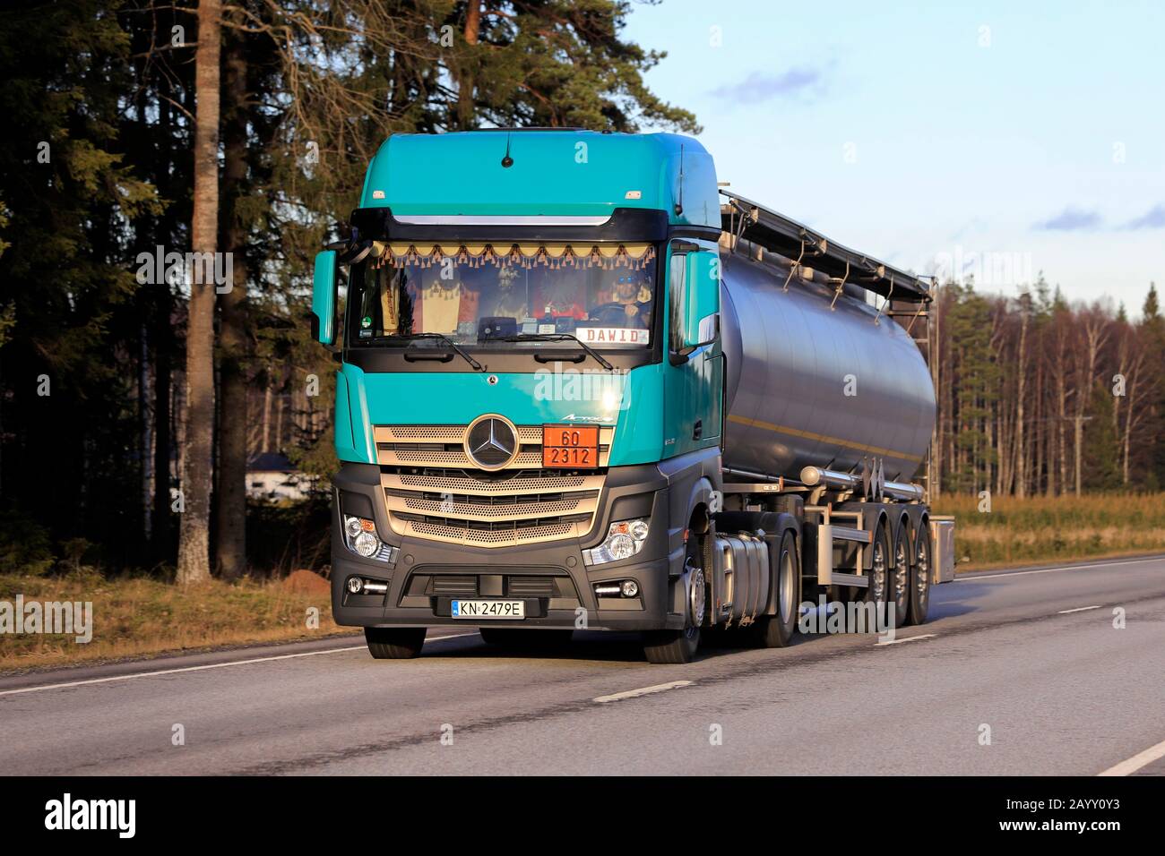 Turquoise Mercedes-Benz Actros semi tanker hauls flammable goods on ...